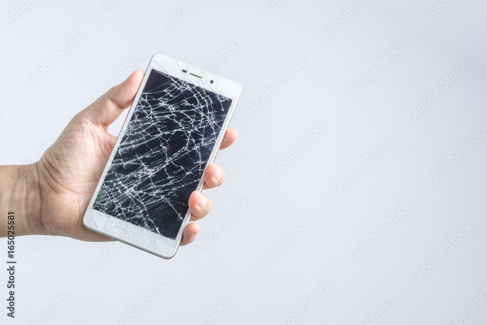 Hand holding mobile phone with broken screen Stock Photo | Adobe Stock