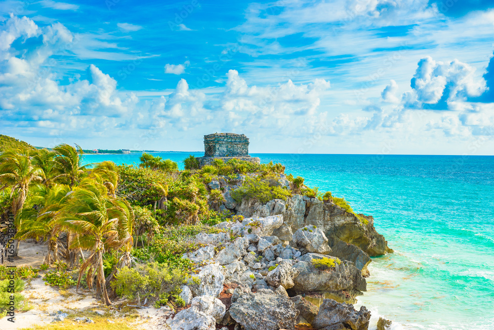 Mayan ruins of Tulum at tropical coast. God of Winds Temple at paradise ...