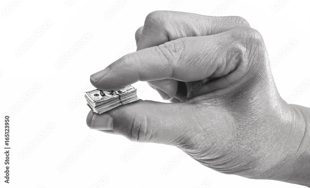 Shrinking the Money. Stock Photo | Adobe Stock