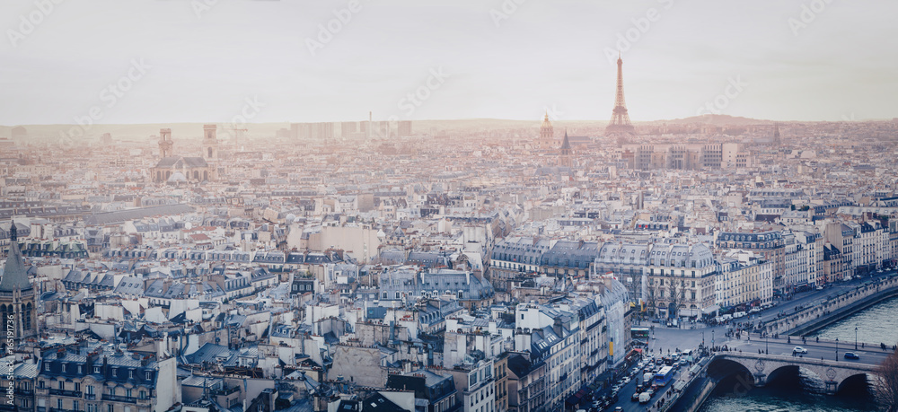Paris skyline at sunset with Eiffel Tower in the distance Stock Photo ...