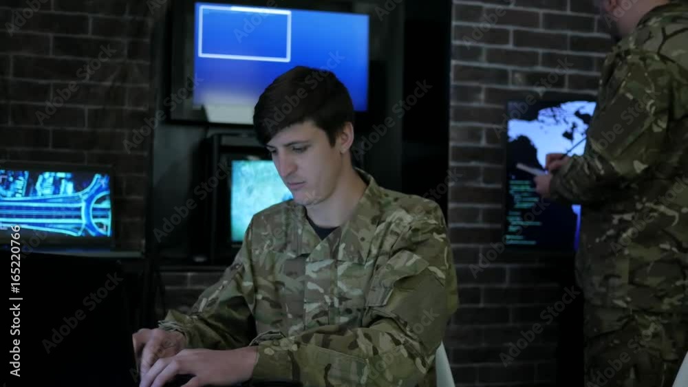 portrait soldier, IT war, field headquarters, on background computer ...