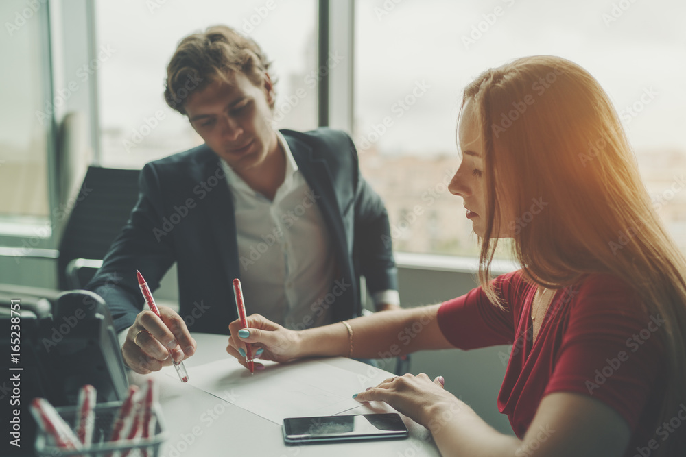 Attractive man entrepreneur having work conversation with his female ...