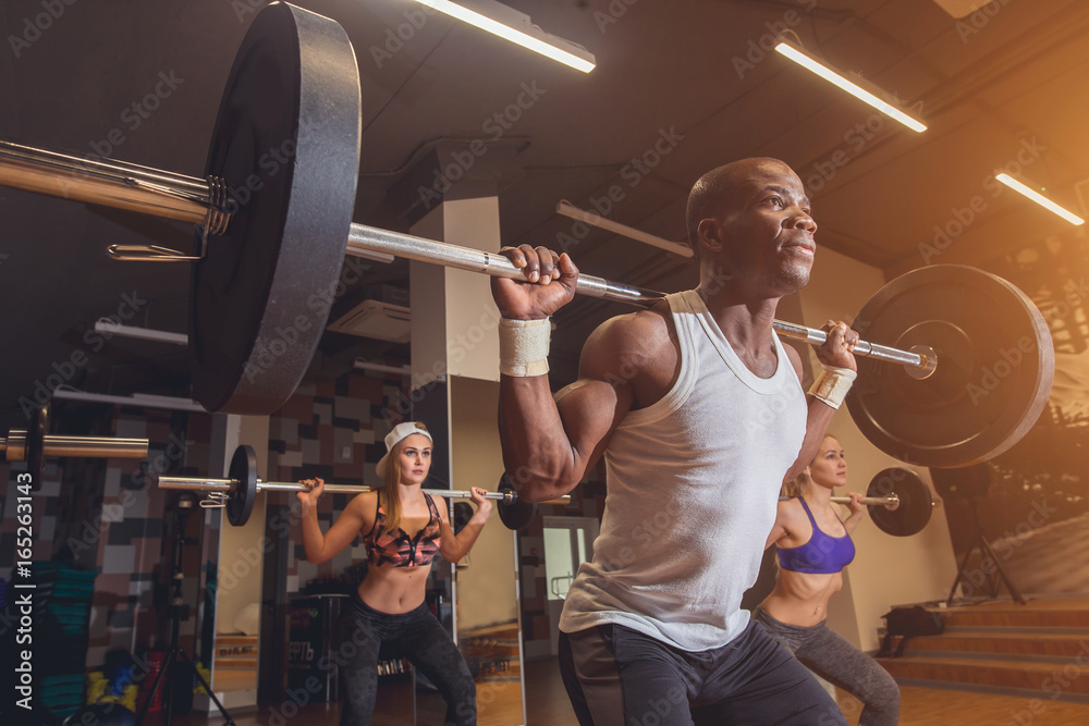 Barbell weight lifting group weightlifting workout exercise gym Stock ...