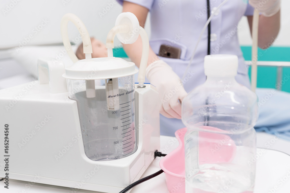 Nurse use Suction Machine, prepare to suction patient's mucus. Stock ...