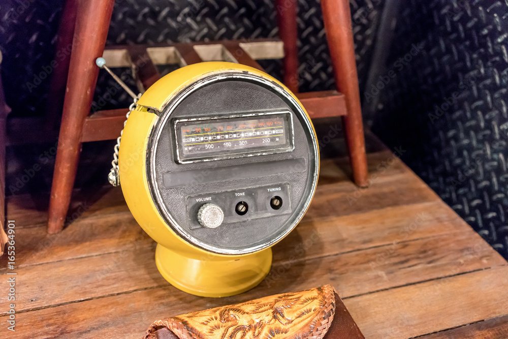 Half-sphere shape vintage radio in yellow Stock Photo | Adobe Stock