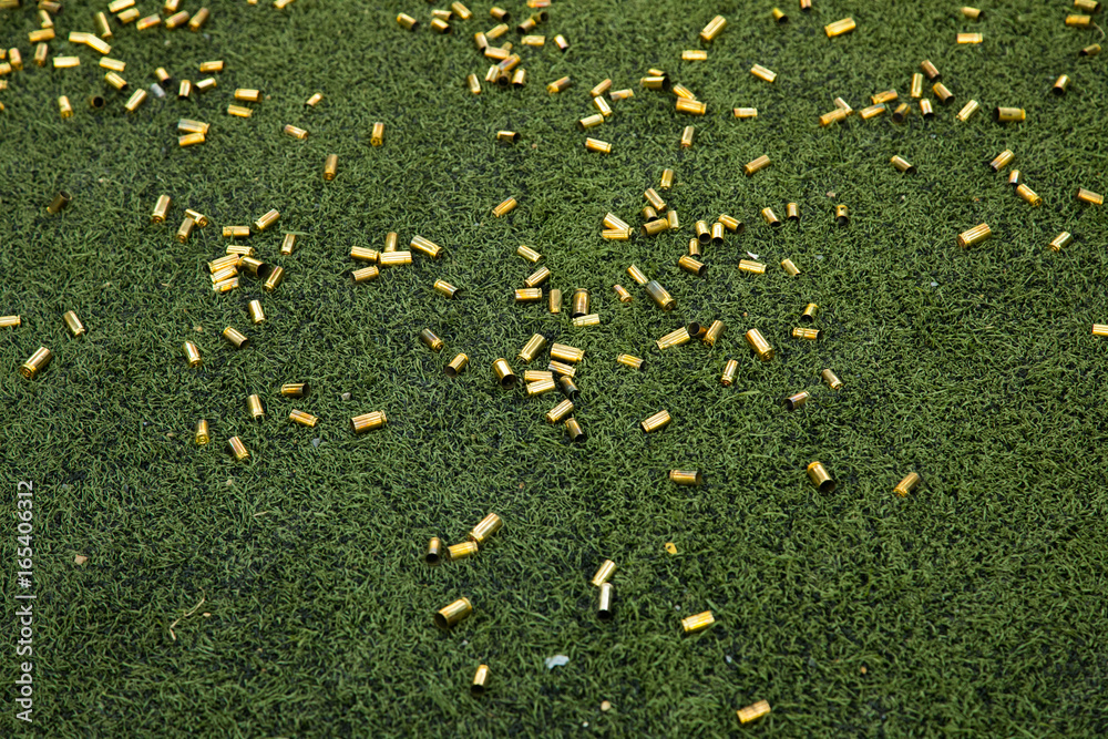 bullet shells ground. Cases of bullets lying on the floor of artificial ...