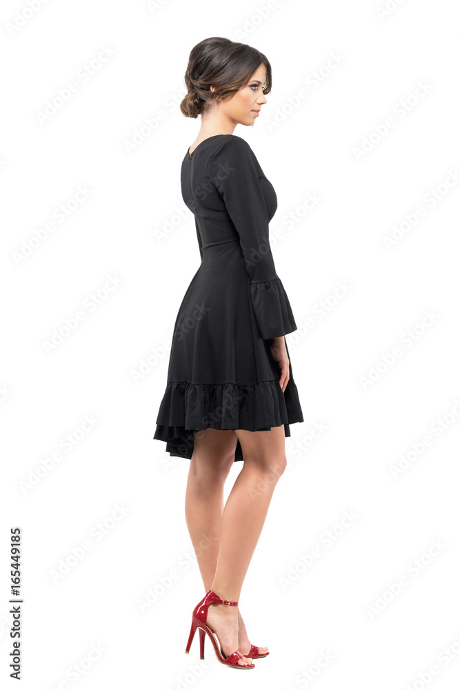 Side view of classy glamour sophisticated woman in black dress looking ...
