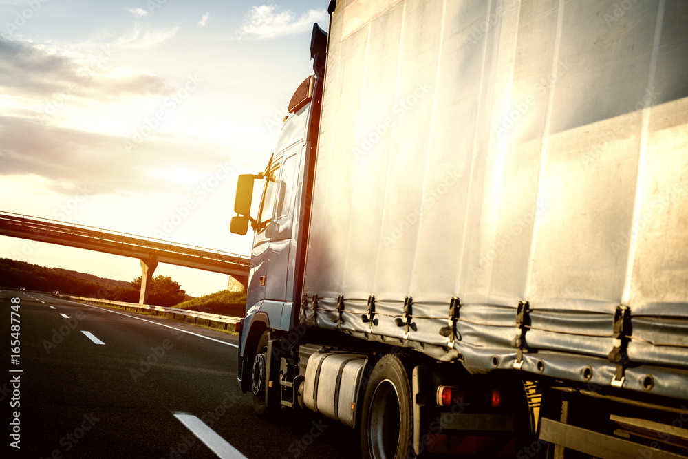 Truck on road. Long vehicle carrying and puling load on highway. Road ...