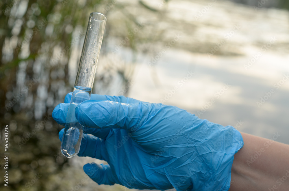 Taking a water test for analysis from a reservoir. Stock Photo | Adobe ...