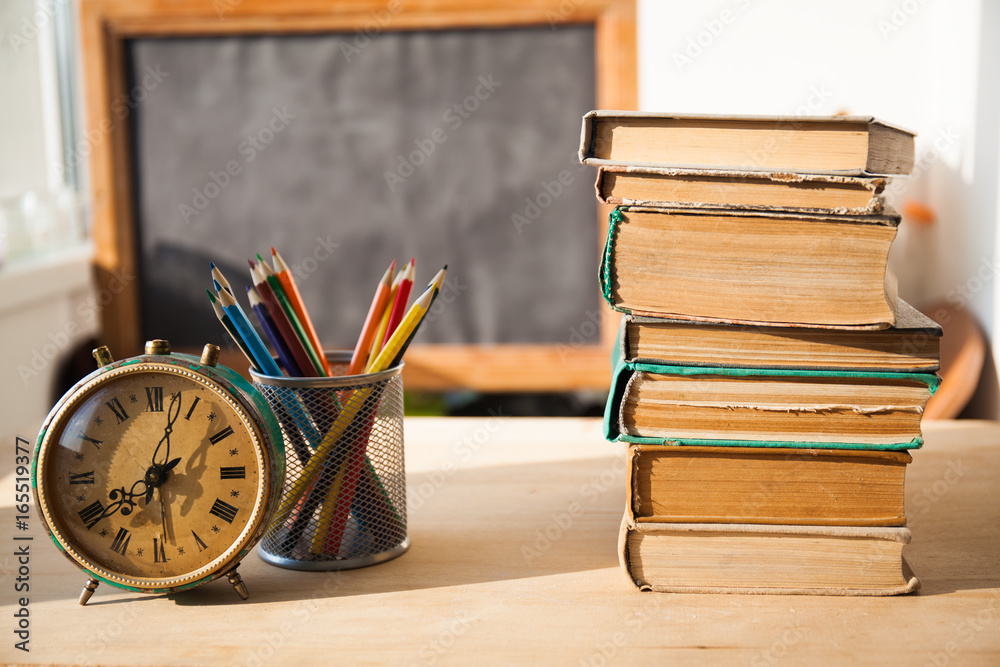 Stack of old books on wood desk Stock Photo | Adobe Stock