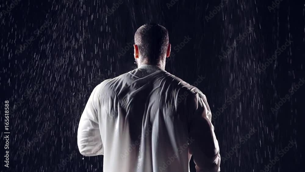 night under heavy rain with their backs to the camera is wet the man in ...