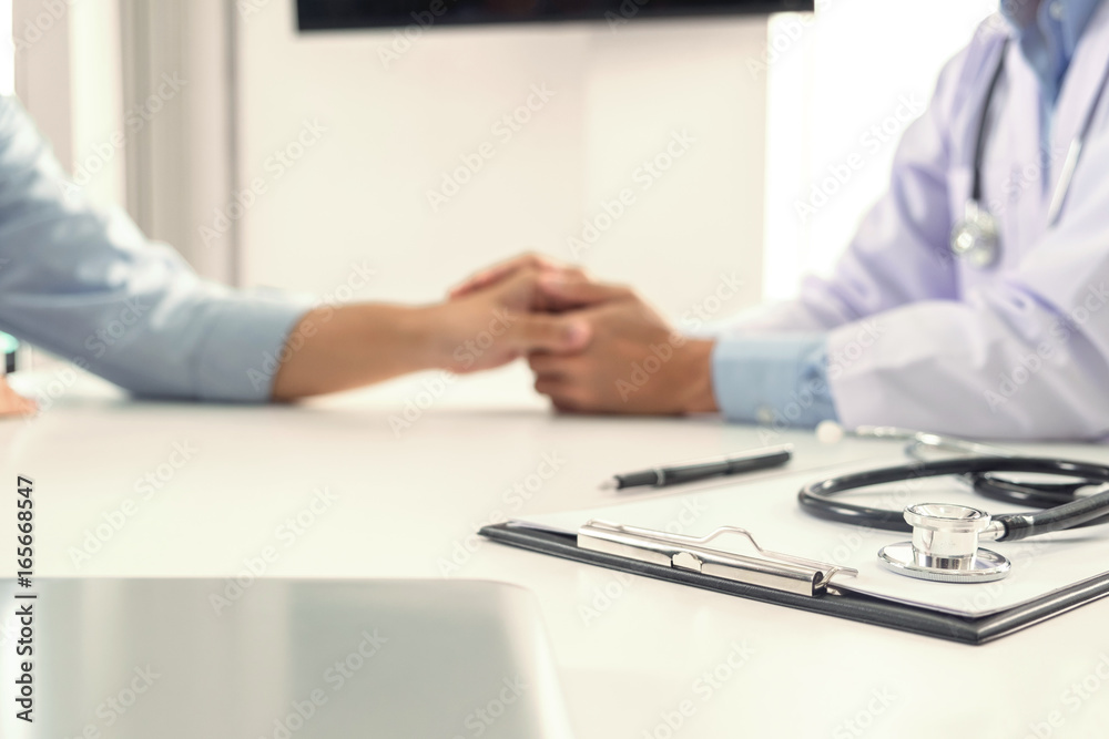 Focus of Medical instruments, stethoscope and doctor touching patient ...