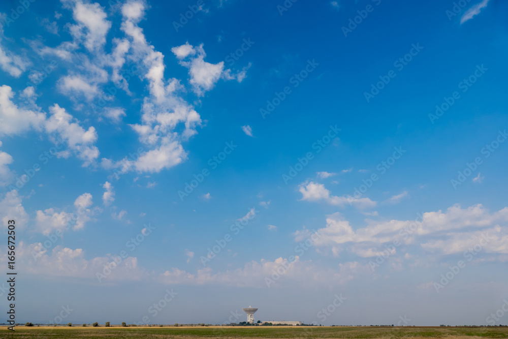 Radar station on background of blue sky / Tower with radar ...