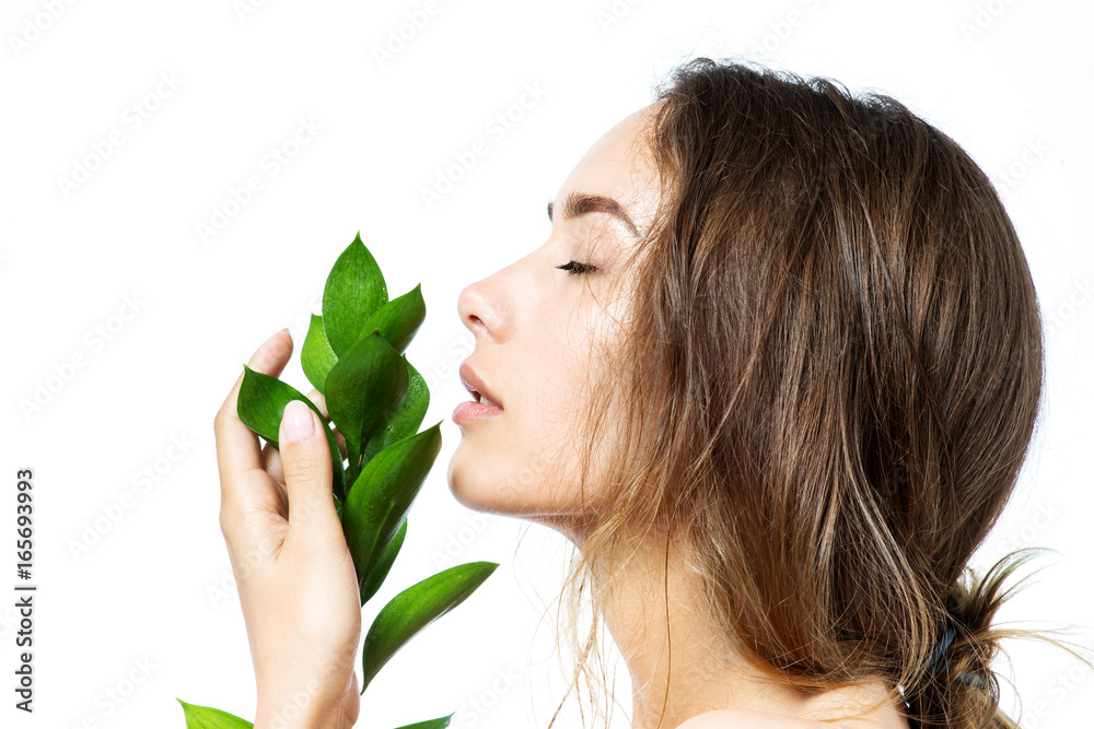 Beautiful woman face with green leaf Stock Photo | Adobe Stock