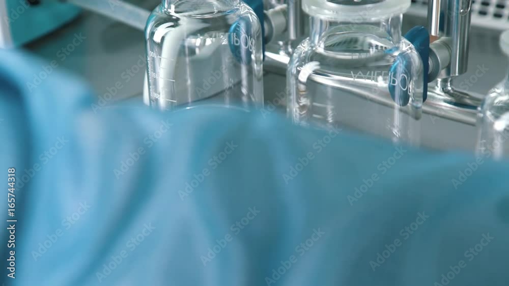 Laboratory equipment and lab assistant's work: hands of the scientist ...