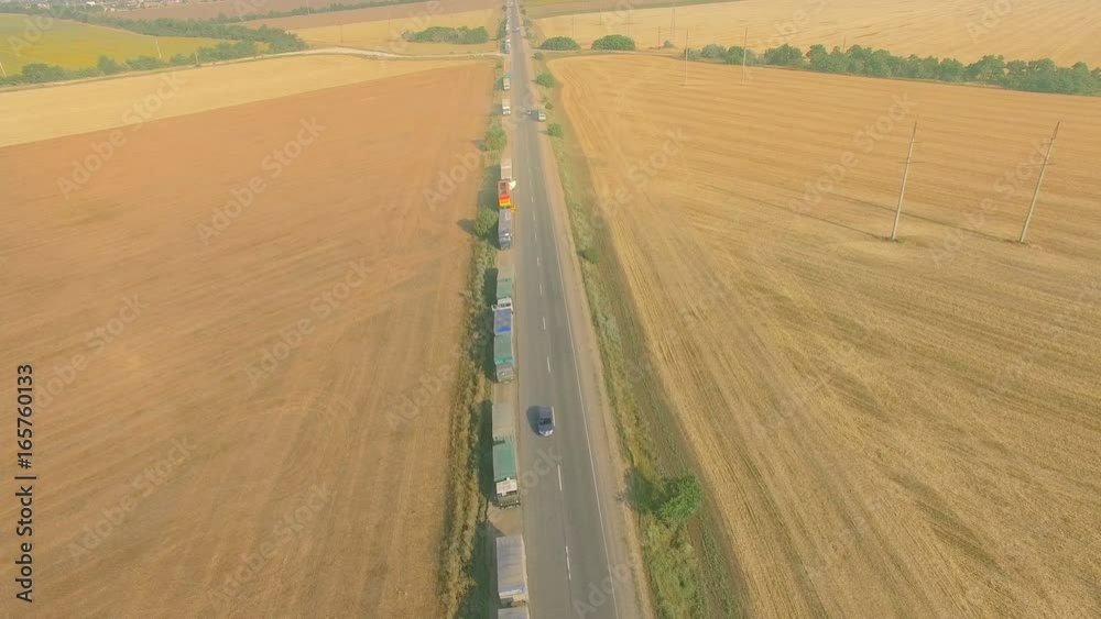 Overhead drone footage of transport network trucks shipping, supply ...