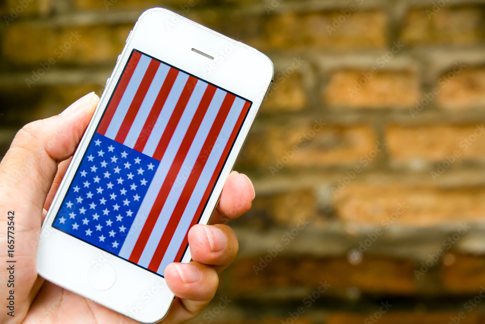 USA flag on mobile phone with brick background for usa national day ...