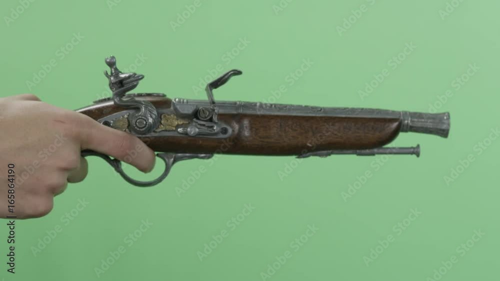 Man with an old pistol. Vintage antique flintlock pistol isolated on ...