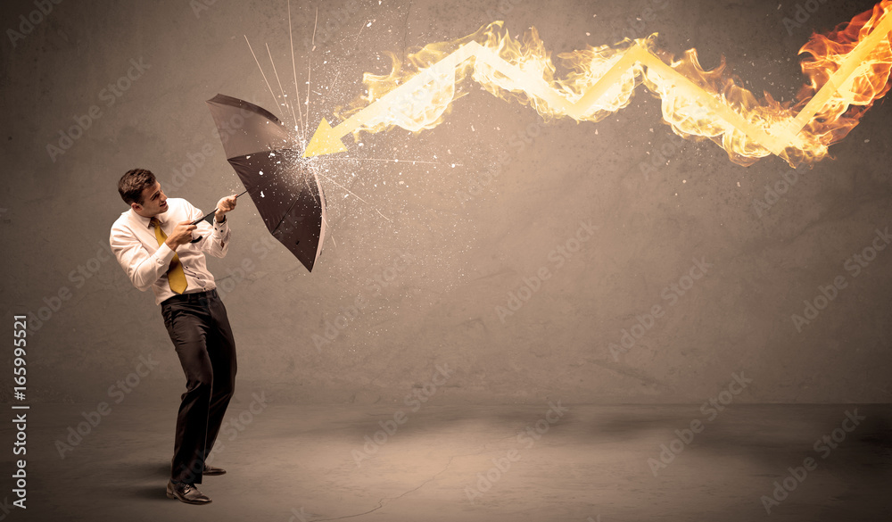 Business man defending himself from a fire arrow with an umbrella Stock ...