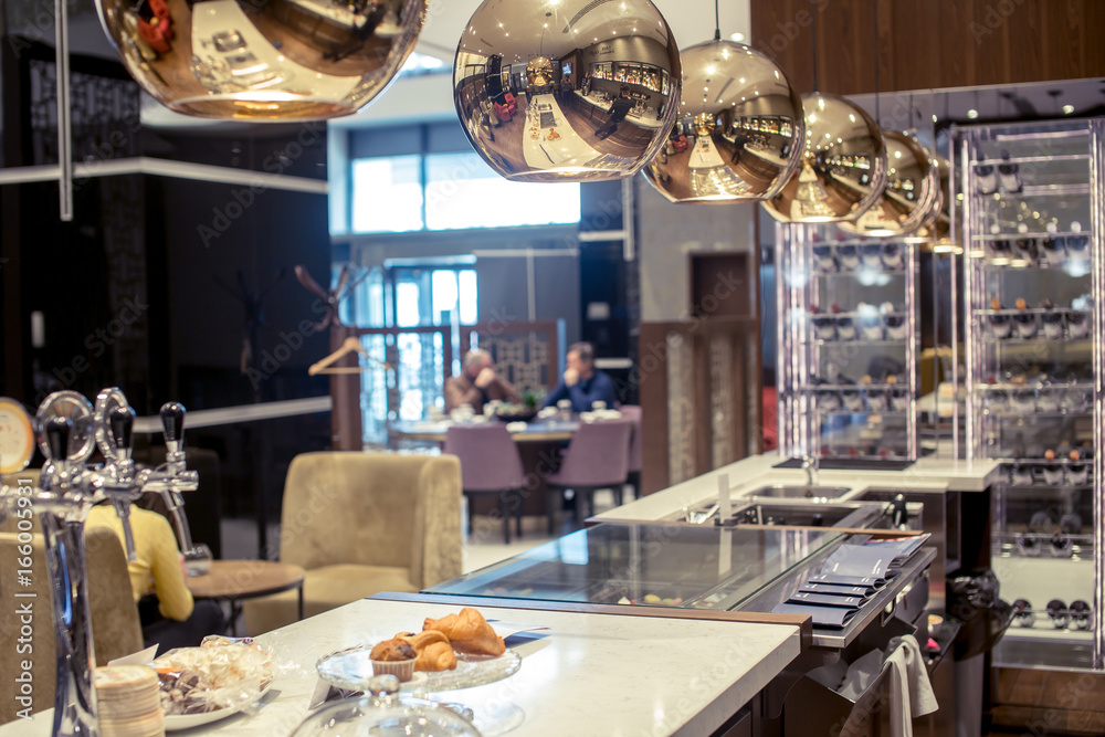 Restaurant kitchen interior: bar counter made of natural stone, fences ...