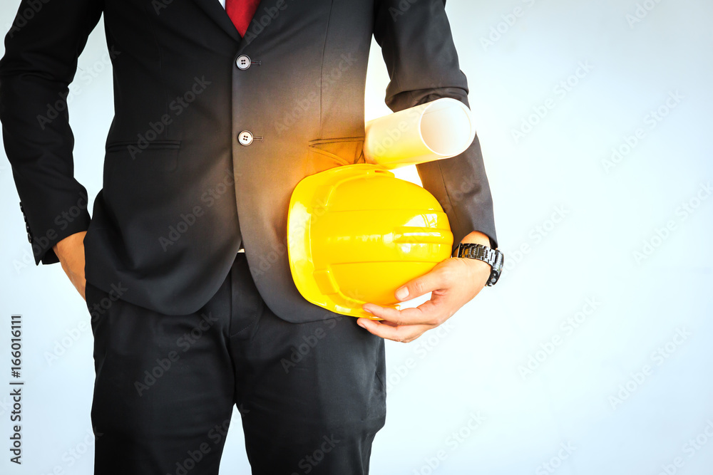 Engineering man with yellow safety helmet standing in front of oil ...
