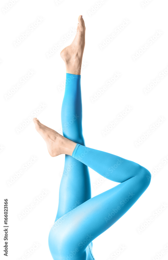 Legs of beautiful young woman in footless tights on white background ...