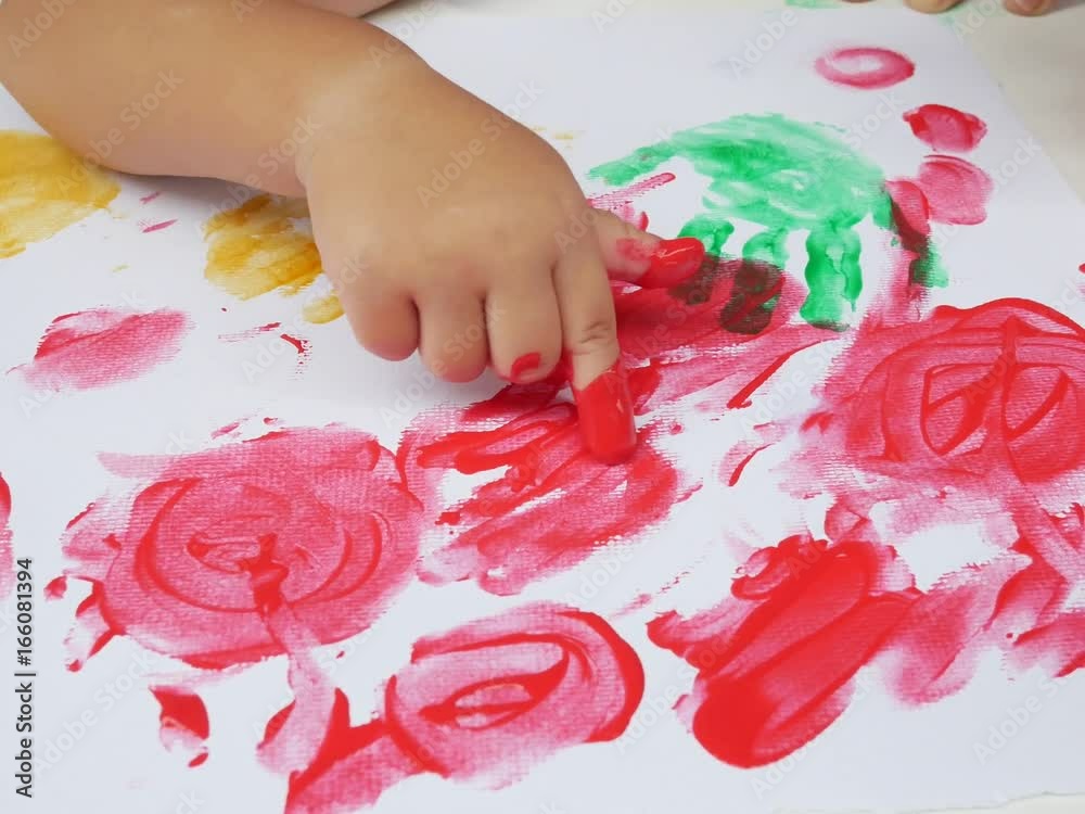 Little girl painting by finger hand paint color ,unlimited boundless ...