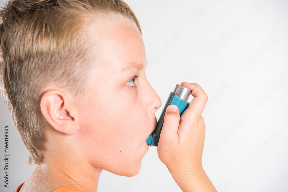 A child with an inhaler, an asthma attack, a treatment, an allergy ...