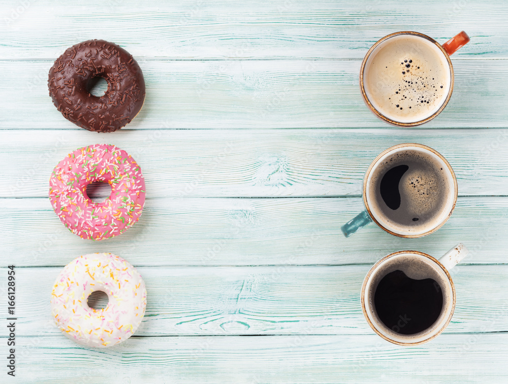 Coffee cup and colorful donuts Stock Photo | Adobe Stock