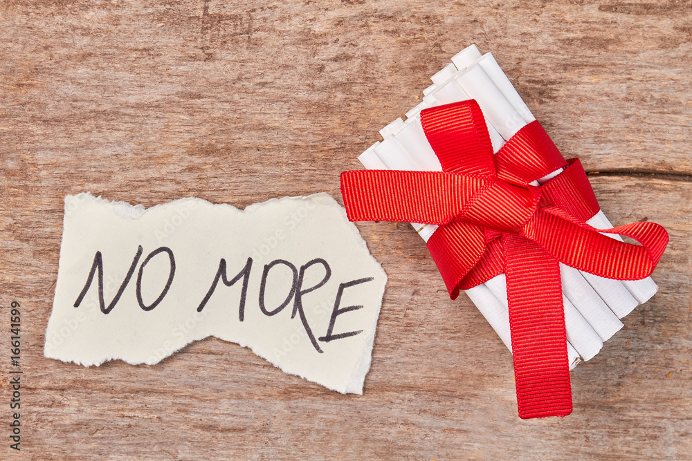 No more tobacco cigarettes concept. Pile of nicotine cigarettes with ...