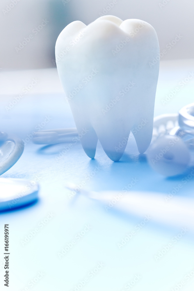Dental model and dental equipment on blue background, concept image of ...