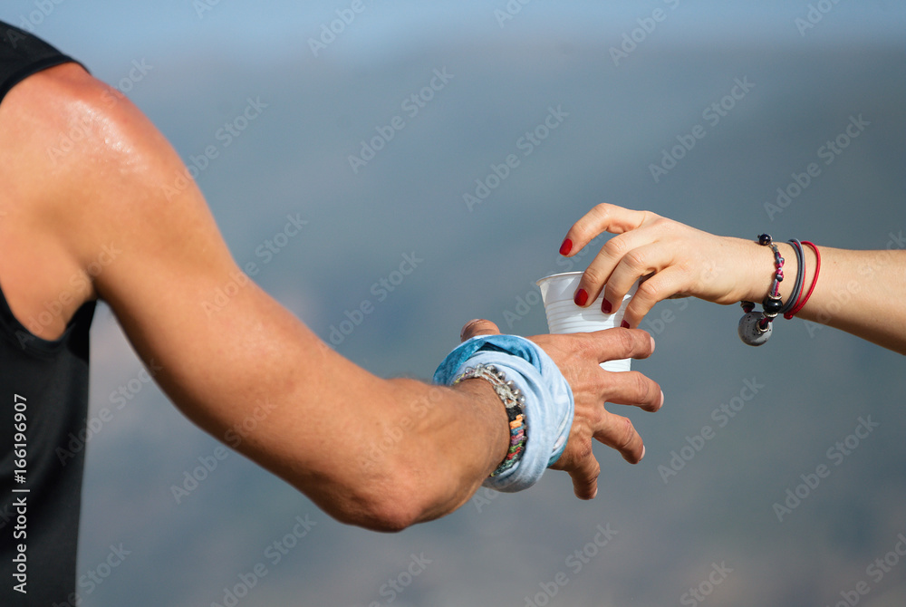 Drinks station at a trail running marathon,hydration drinking during a ...