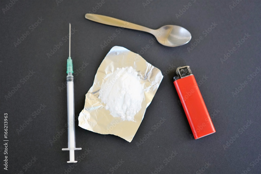 Drug, syringe, spoon, lighter and cooked heroin Stock Photo | Adobe Stock