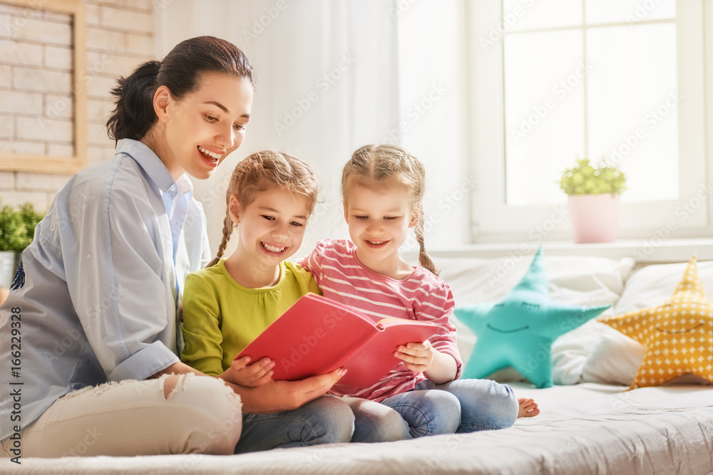 mother reading a book Stock Photo | Adobe Stock