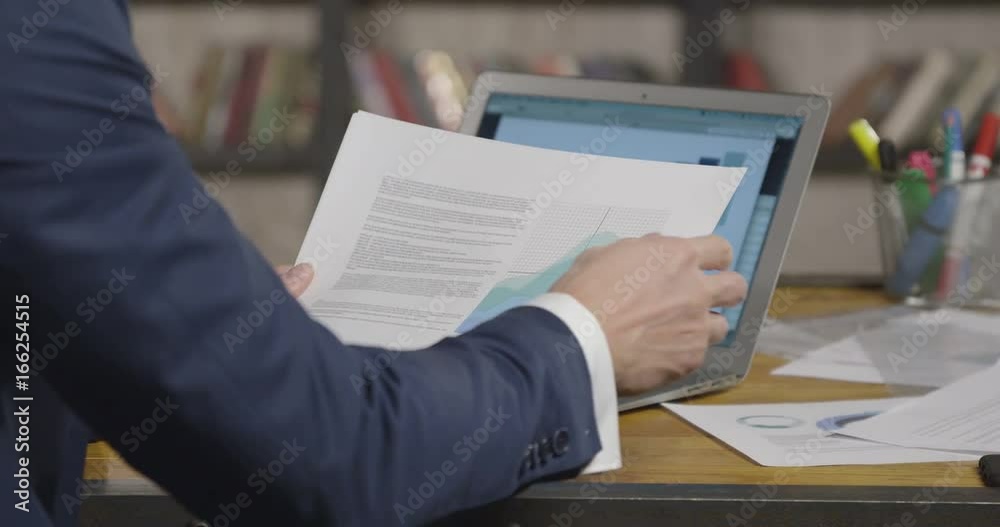 Slow Motion Portrait of Successful Businessman Flipping Through the ...