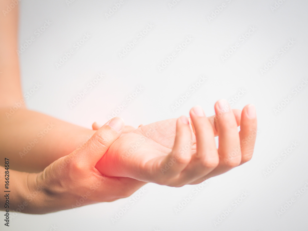 health care concept. Close up woman holding her wrist symptomatic ...
