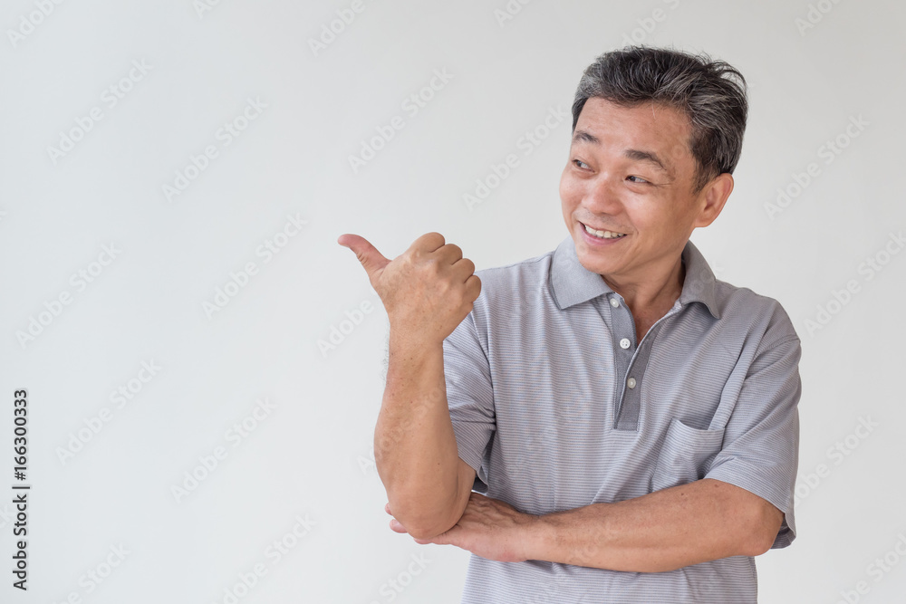 old, middle aged, senior asian man pointing thumb up finger gesture ...