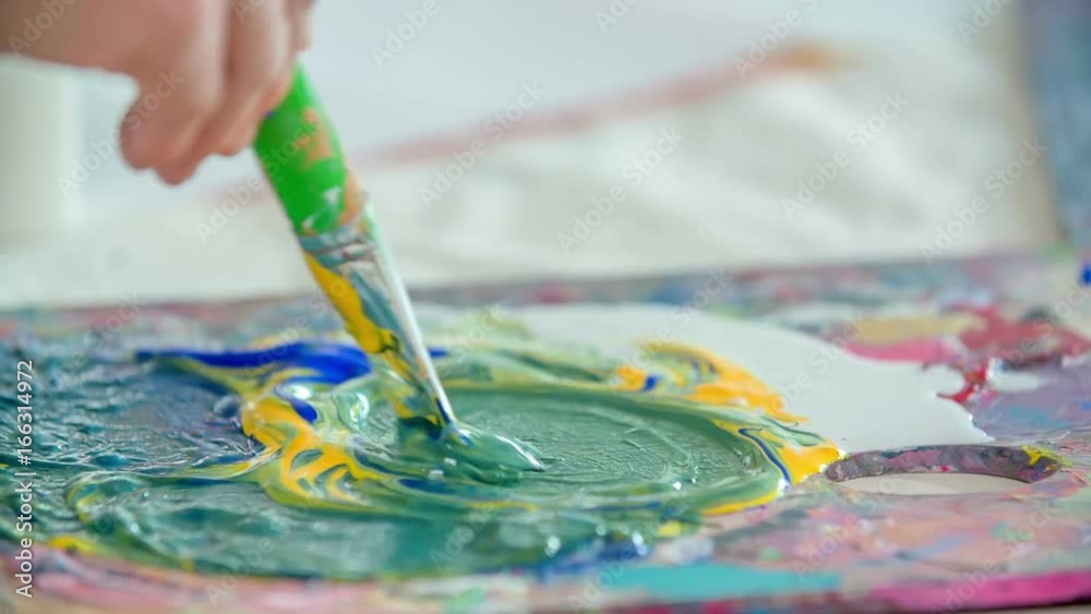 Kids are using tempera colours in their art class and they are making ...