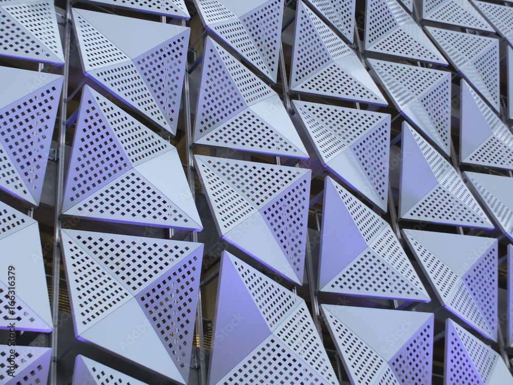 futuristic metal geometric cladding composed of angular metal sheets ...