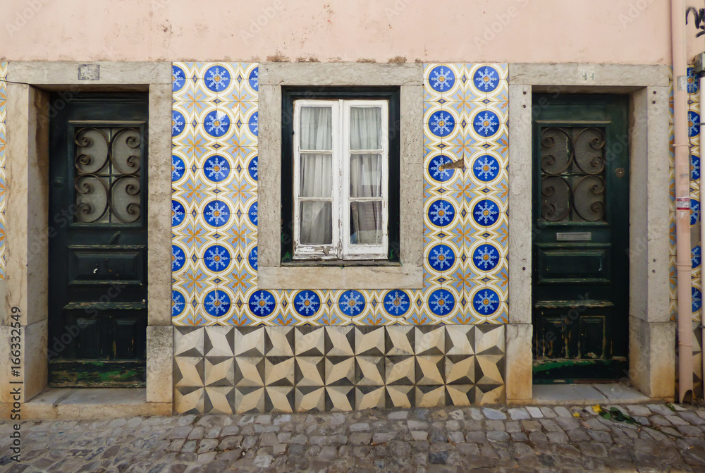 Facade of a Portuguese house decorated with vintage Portuguese tiles ...