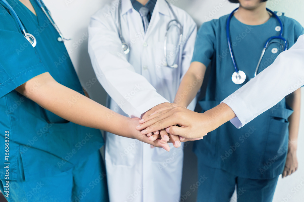 Doctors and nurses coordinate hands. Concept Teamwork, happy doctors ...