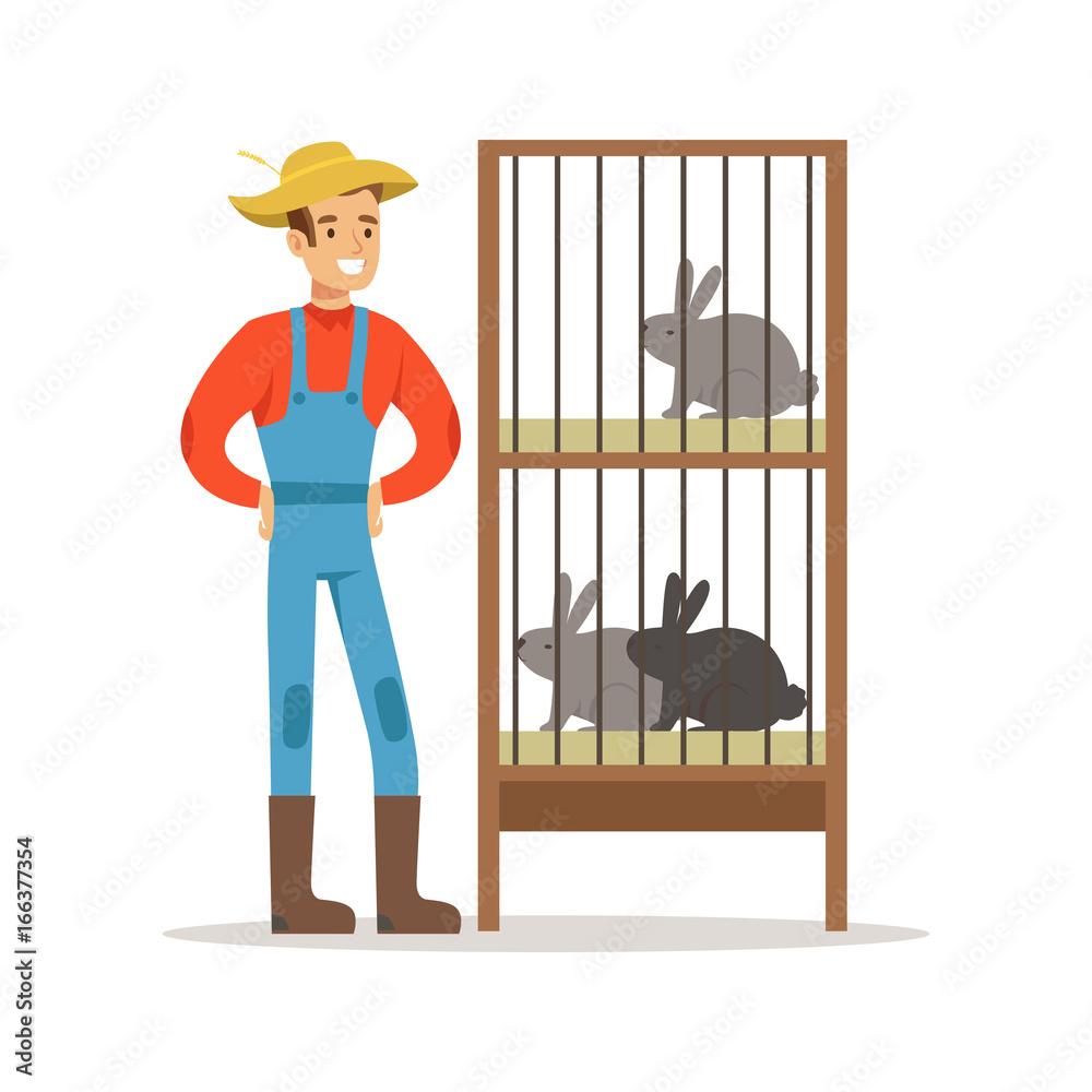 Smiling farmer standing next to rabbit cages, farming and agriculture ...