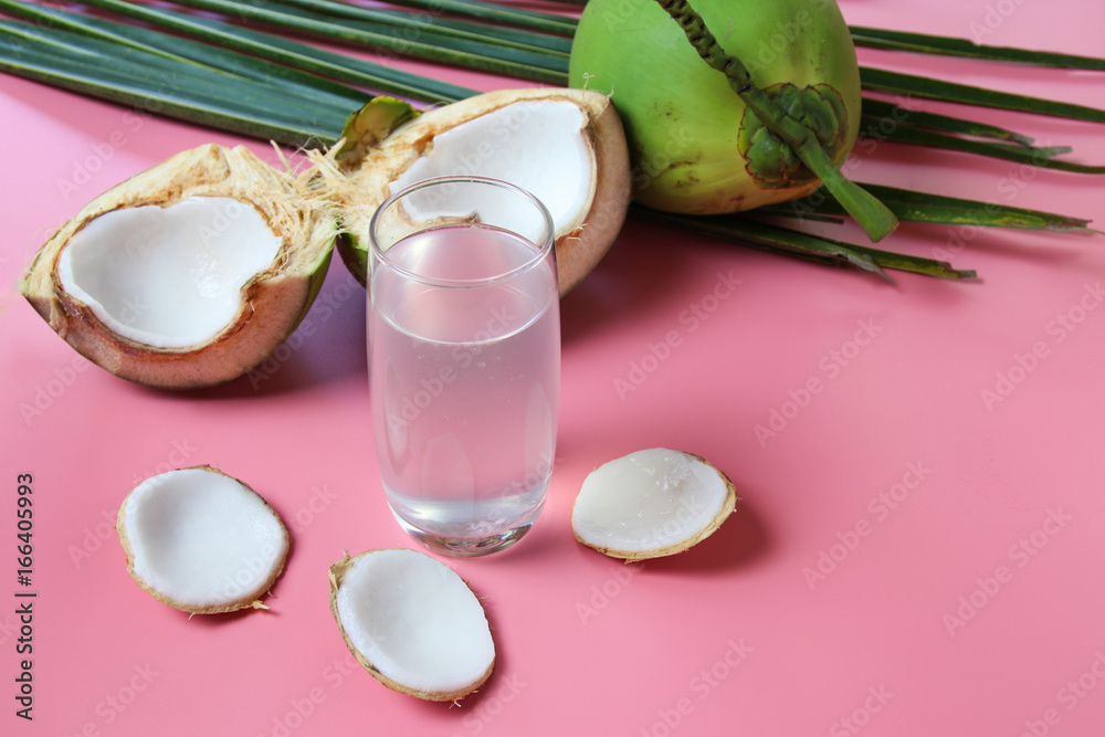 Fresh coconut water in glass Ready to drink with leaf on pink ...