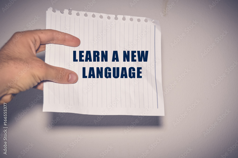 Learn A New Language written on white paper, Education Concept Stock ...