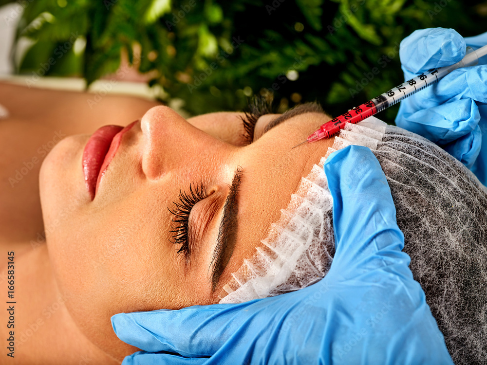 Filler injection for female forehead face. Plastic aesthetic facial ...