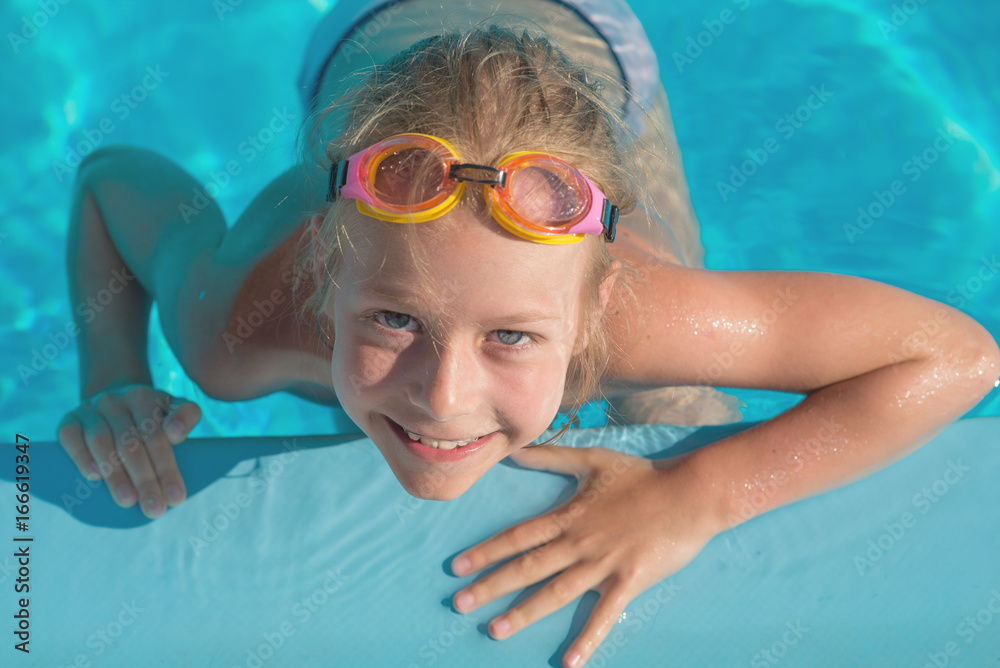 Joyful child in the pool, portrait Stock Photo | Adobe Stock