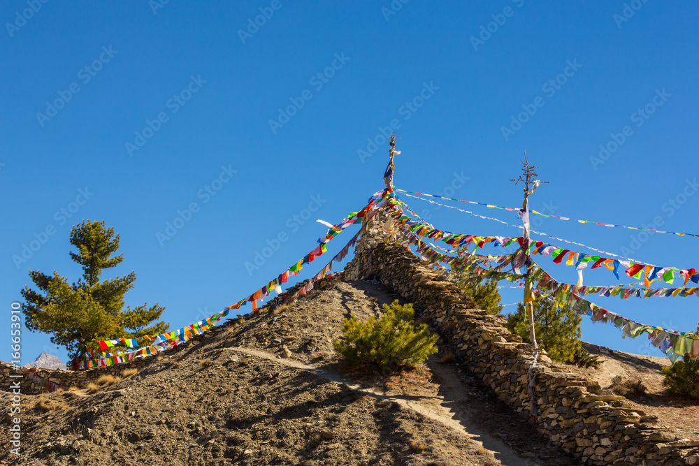 Colorful prayer flags, blowing in the wind in the Himalaya, on the ...
