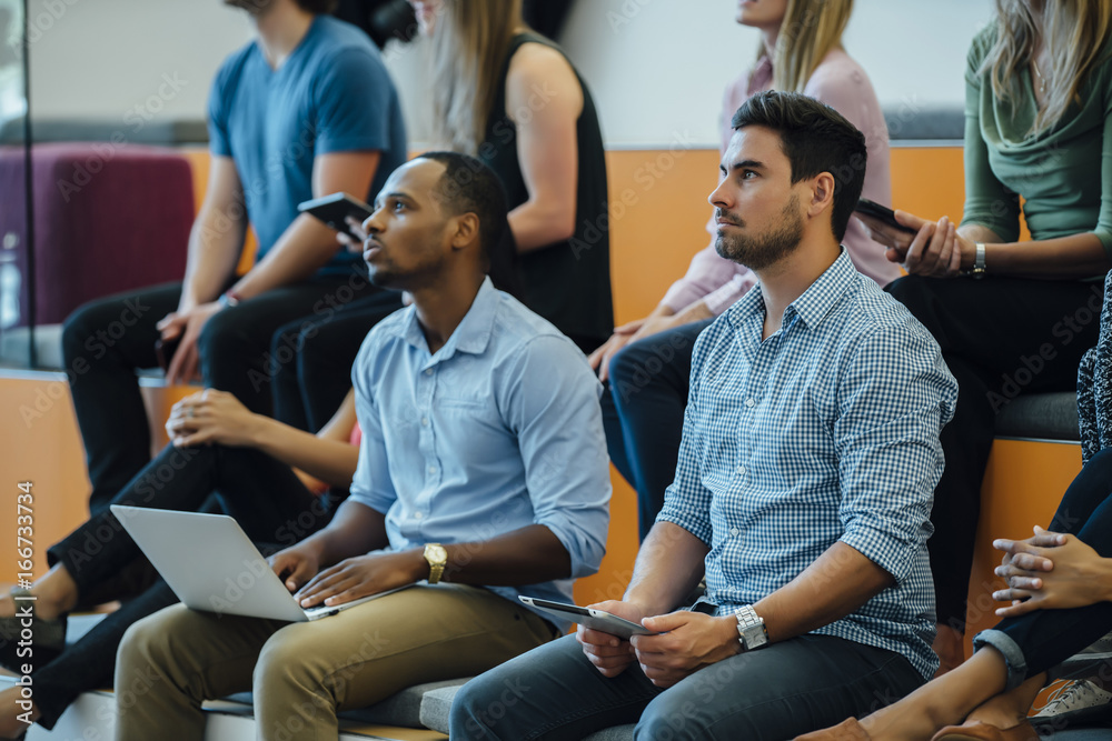 Group of people enjoying a lecture in a modern auditorium Stock Photo ...