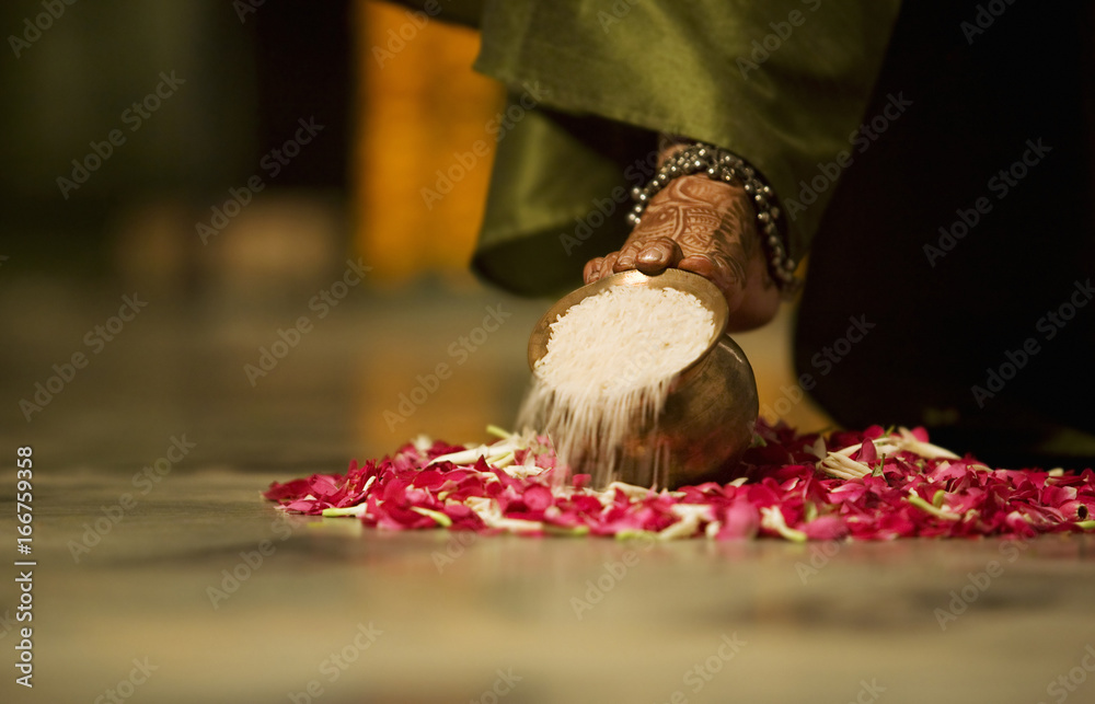 Bride performing a ritual Stock Photo | Adobe Stock
