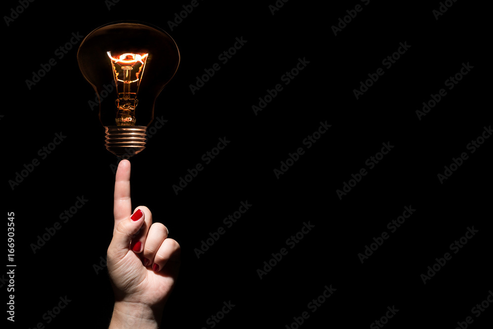 Idea and success coincept. Glowing light bulb without wires on female ...